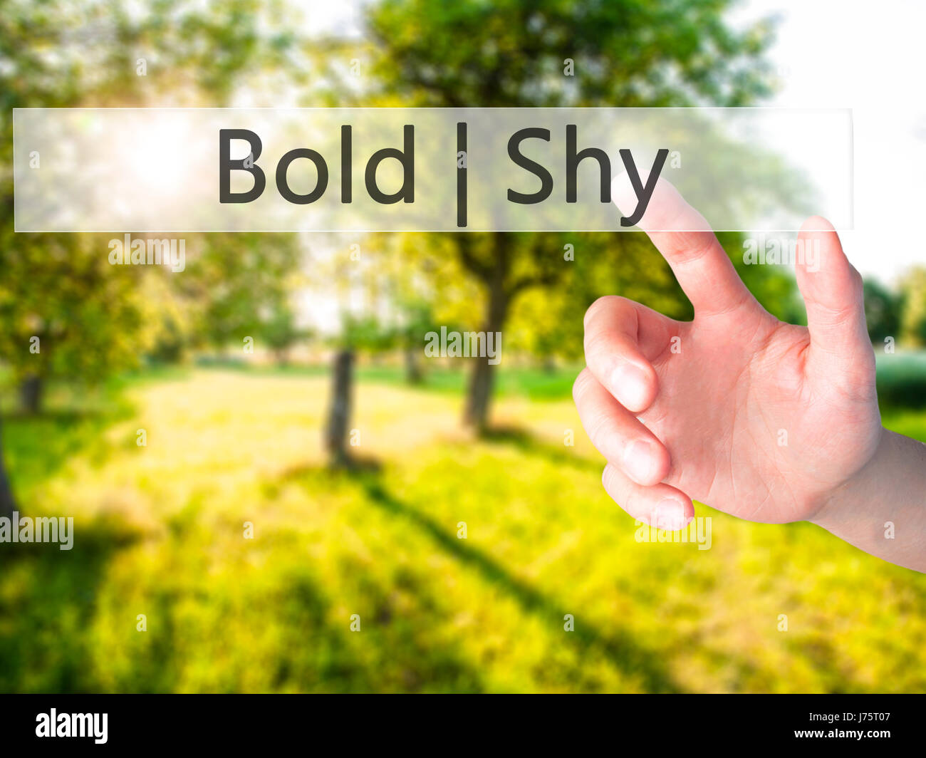 Bold Shy - Hand pressing a button on blurred background concept ...