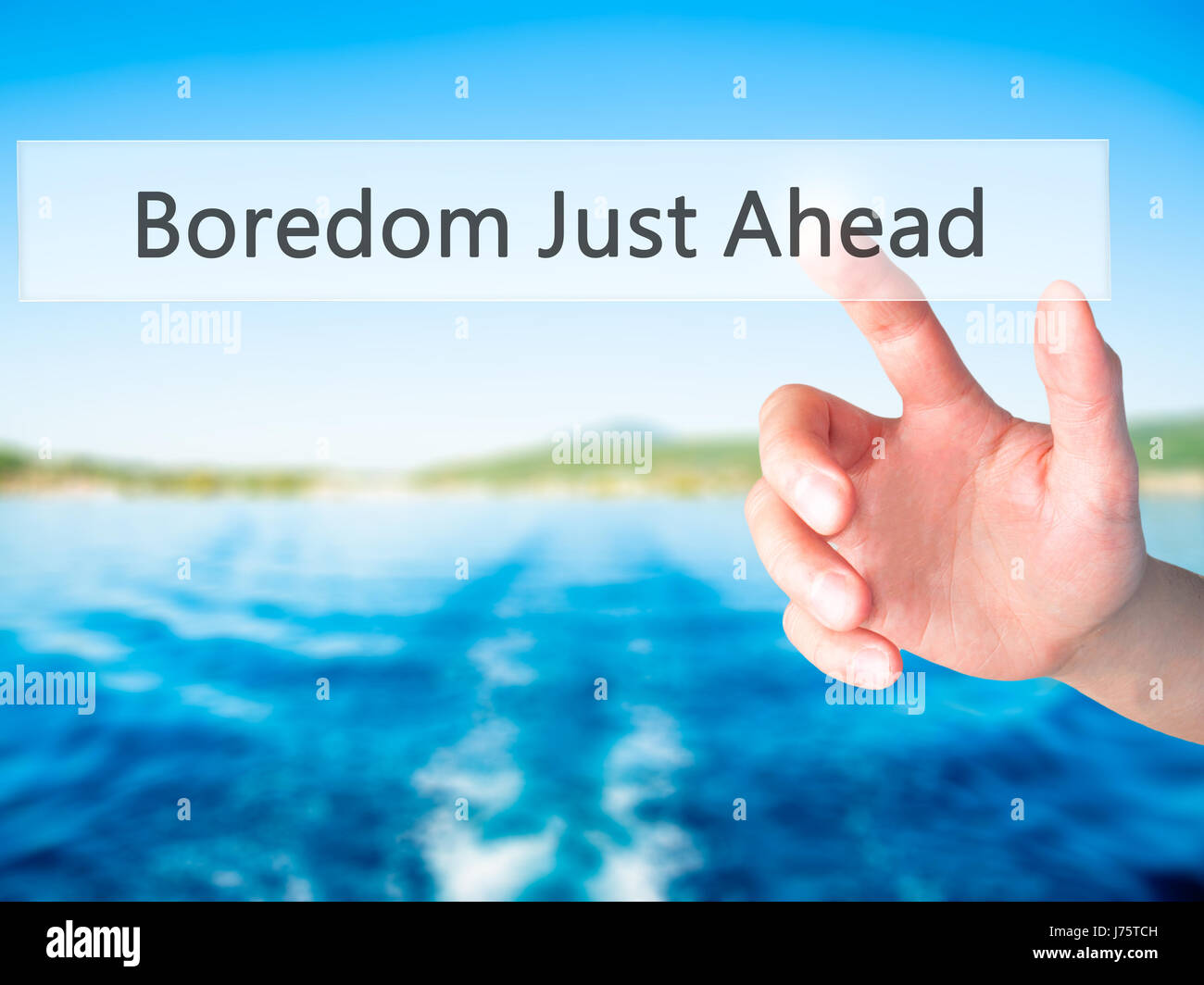 Boredom Just Ahead - Hand pressing a button on blurred background ...