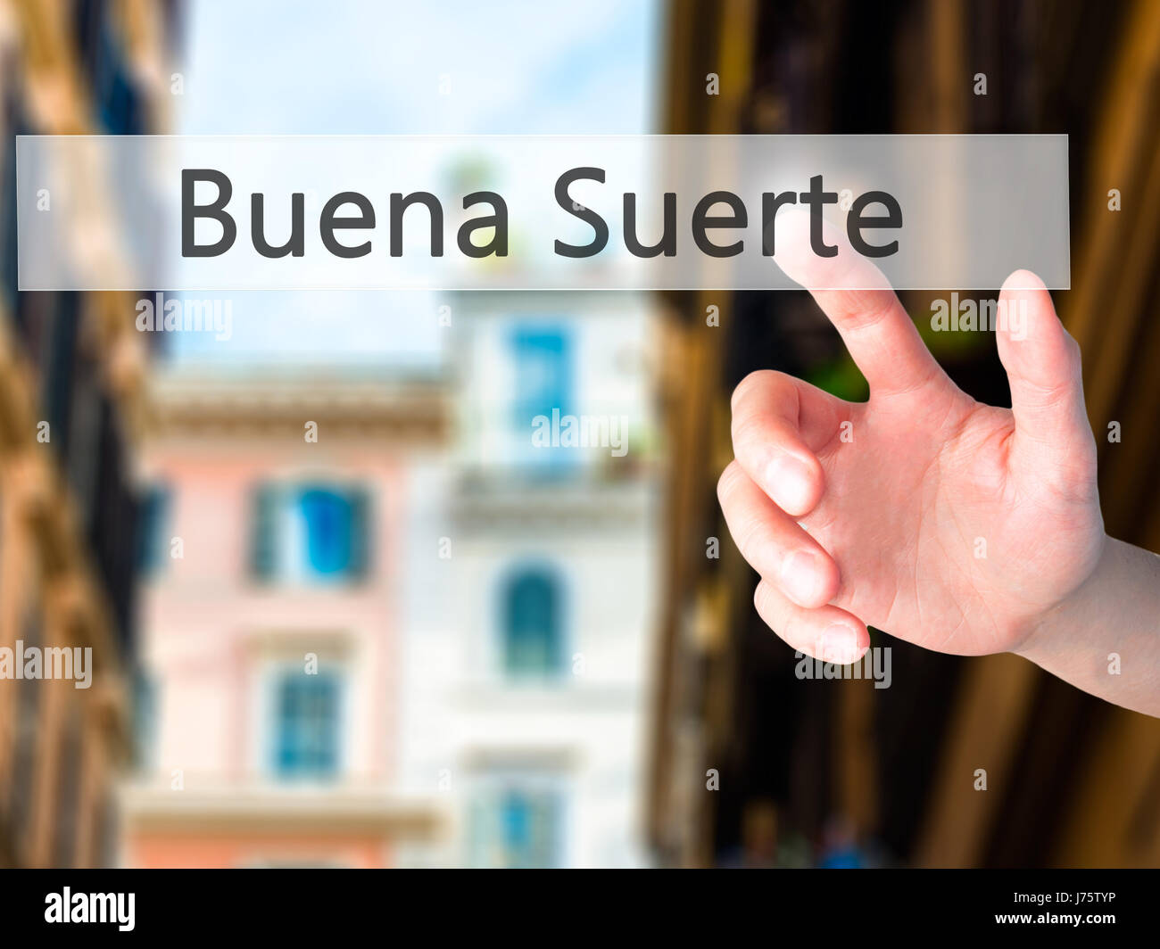 Buena Suerte ( Good Luck in Spanish) - Hand pressing a button on ...
