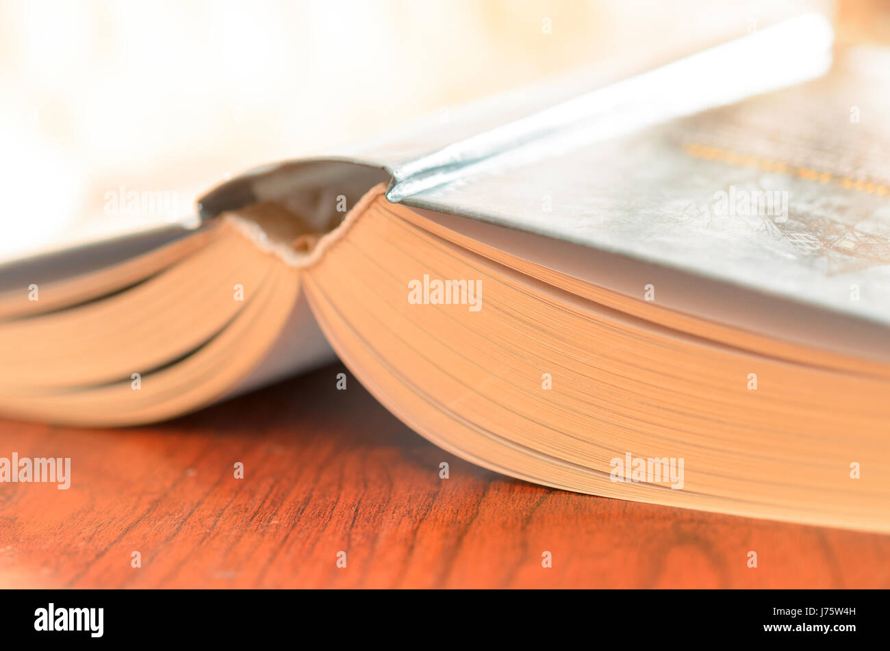 A stack of books on the table in a home setting Stock Photo - Alamy