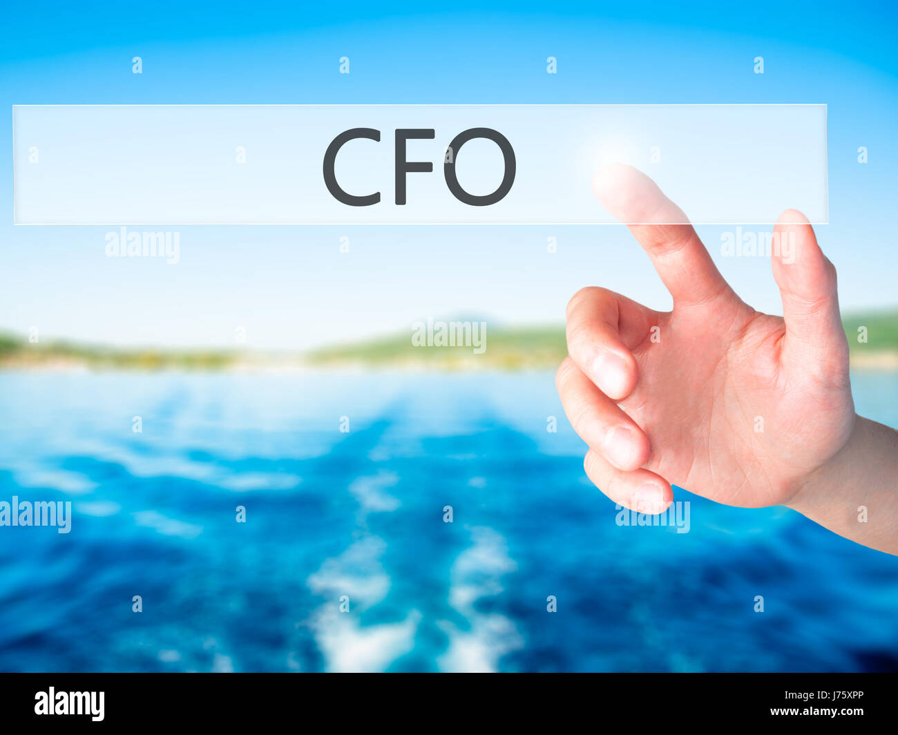 CFO (Chief Financial Officer) - Hand pressing a button on blurred ...