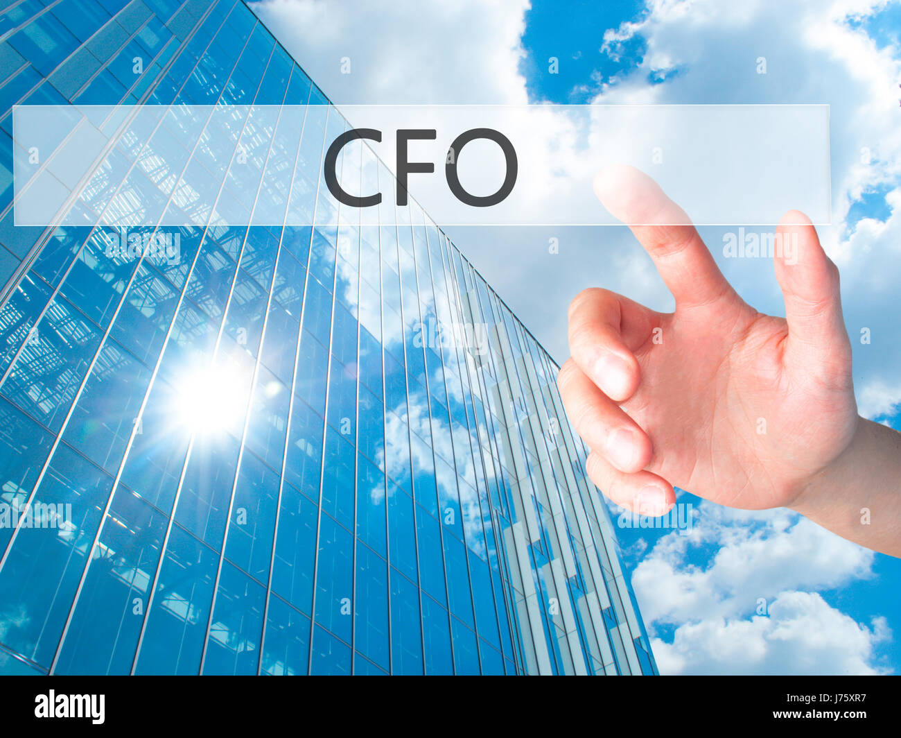 CFO (Chief Financial Officer) - Hand pressing a button on blurred ...