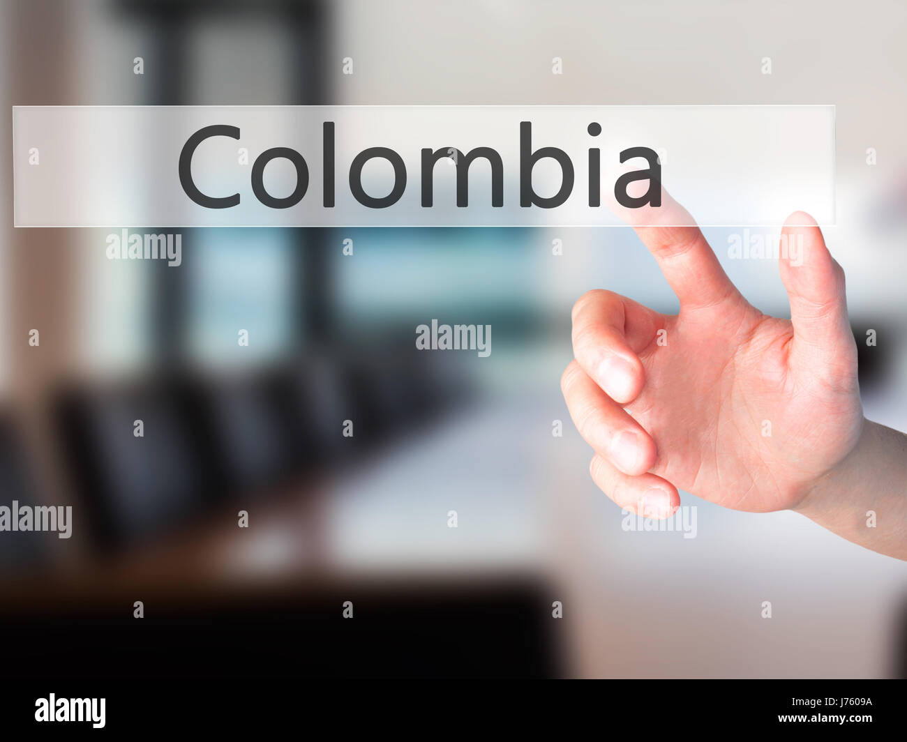 Colombia - Hand pressing a button on blurred background concept ...