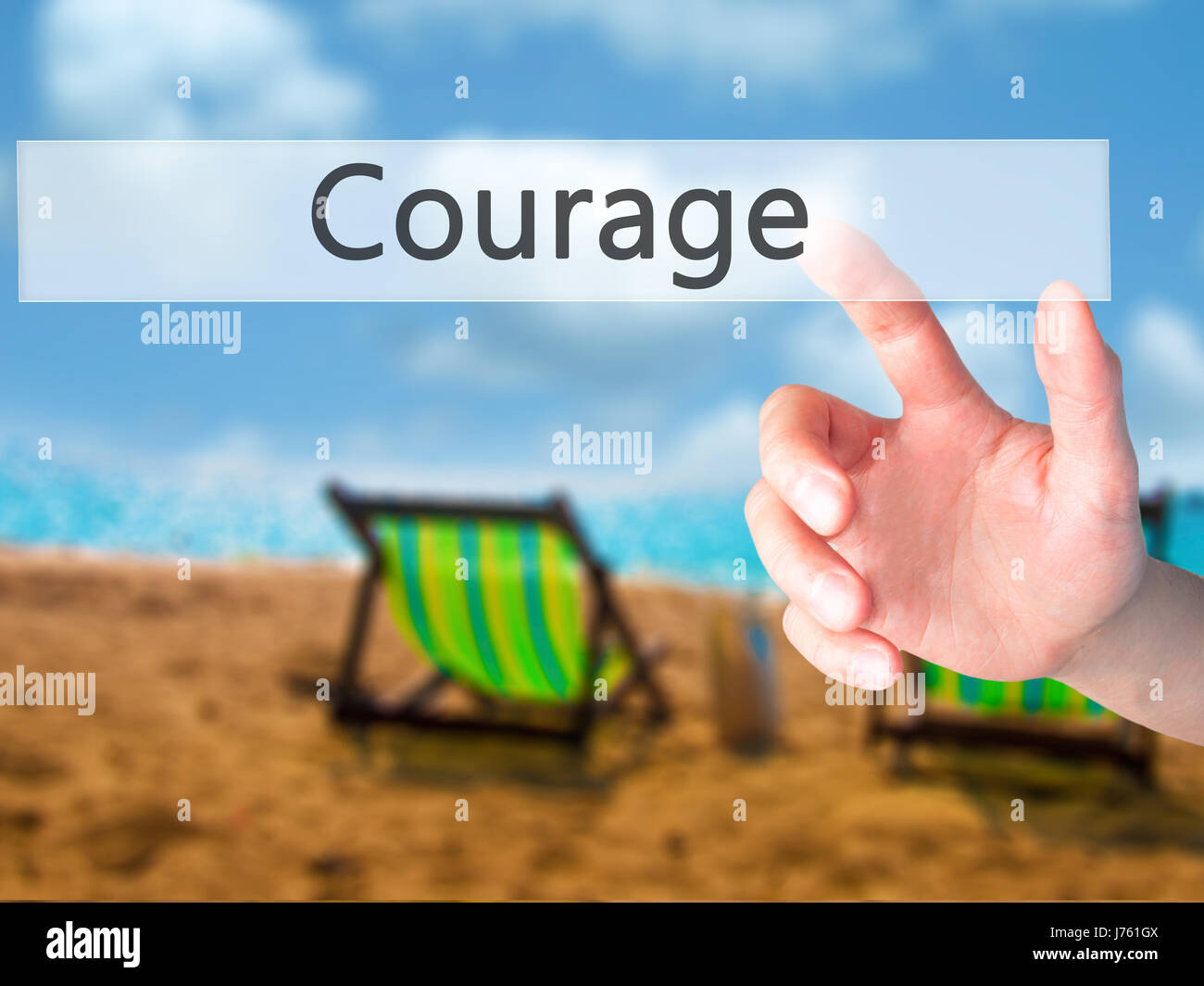 Courage - Hand pressing a button on blurred background concept ...