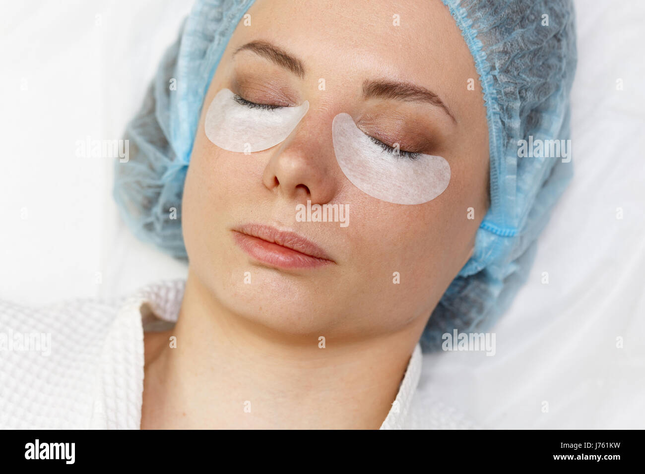 Beauty salon. Preparation of eyelashes of the lower eyelid before the ...