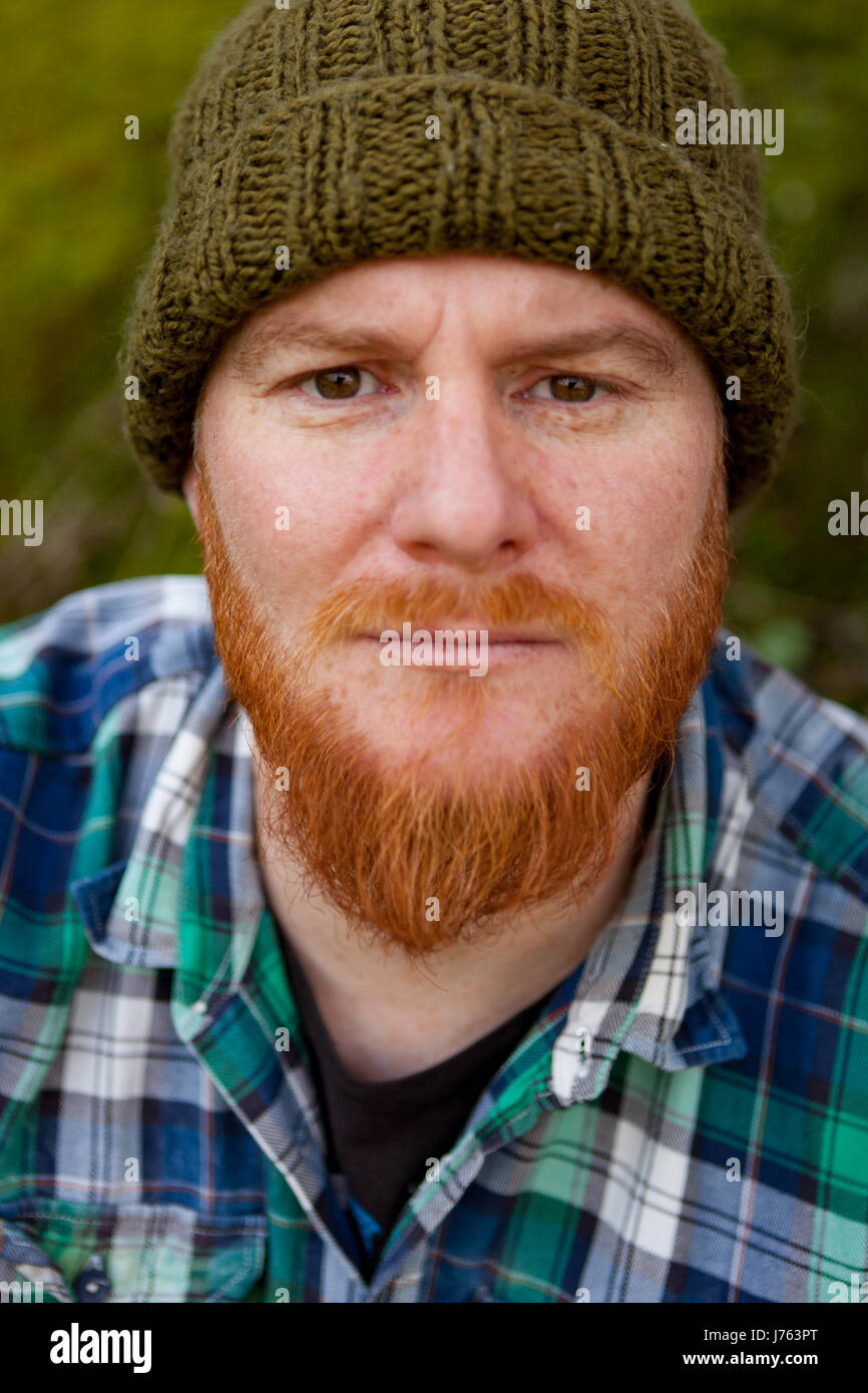 Portrait of a red haired man thinking in th forest Stock Photo - Alamy