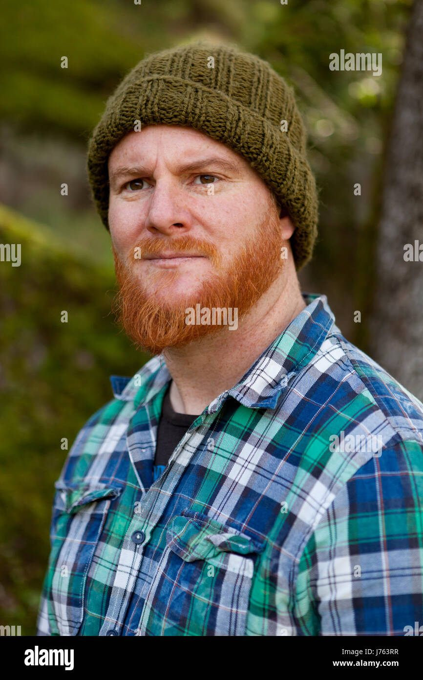 Portrait of a red haired man thinking in th forest Stock Photo - Alamy