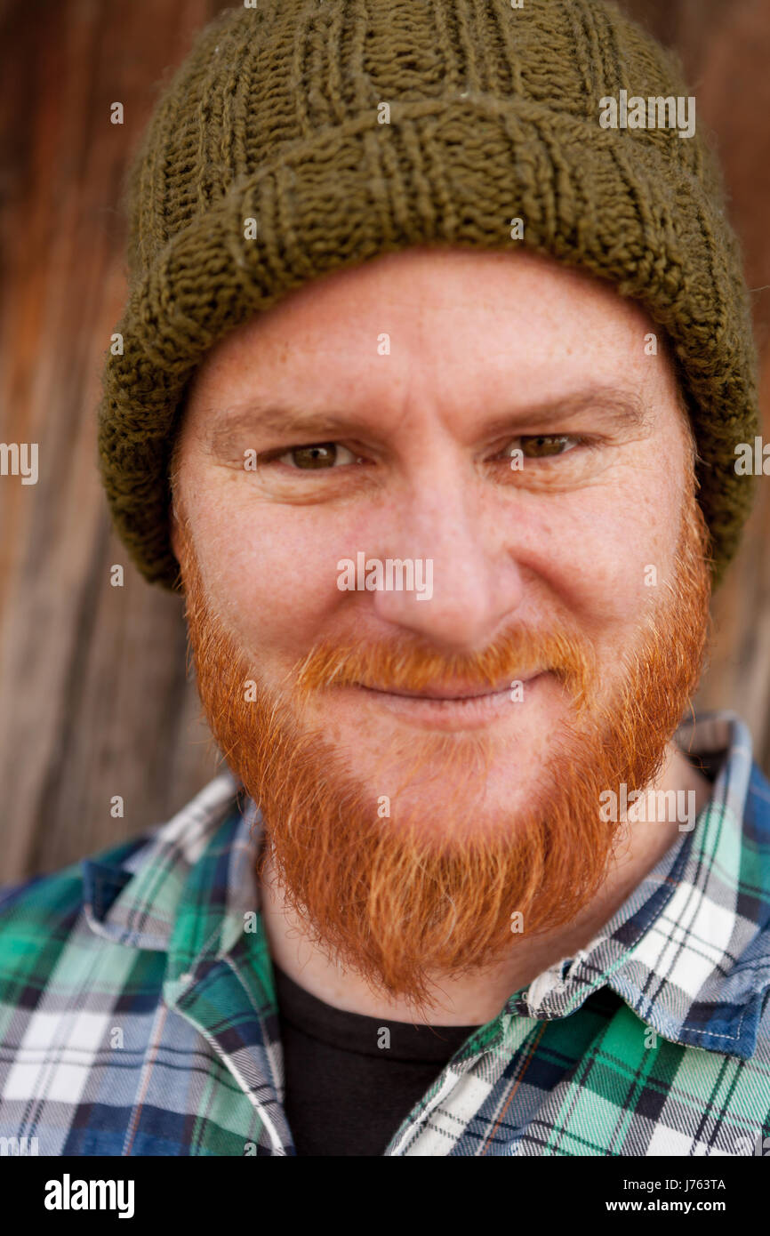 Portrait of a red haired hipster guy putting silly face Stock Photo - Alamy