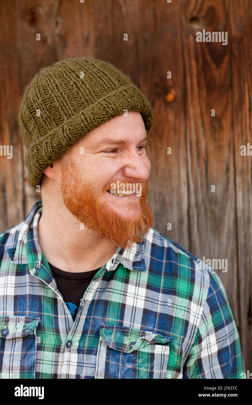 Portrait of a red haired hipster guy putting silly face Stock Photo - Alamy