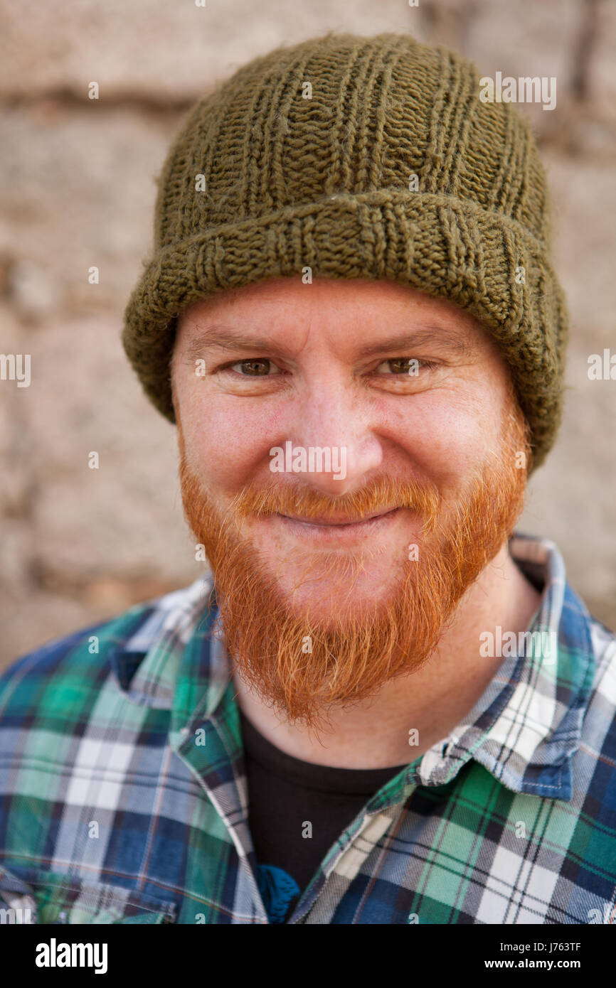 Portrait of a red haired hipster guy putting silly face Stock Photo - Alamy