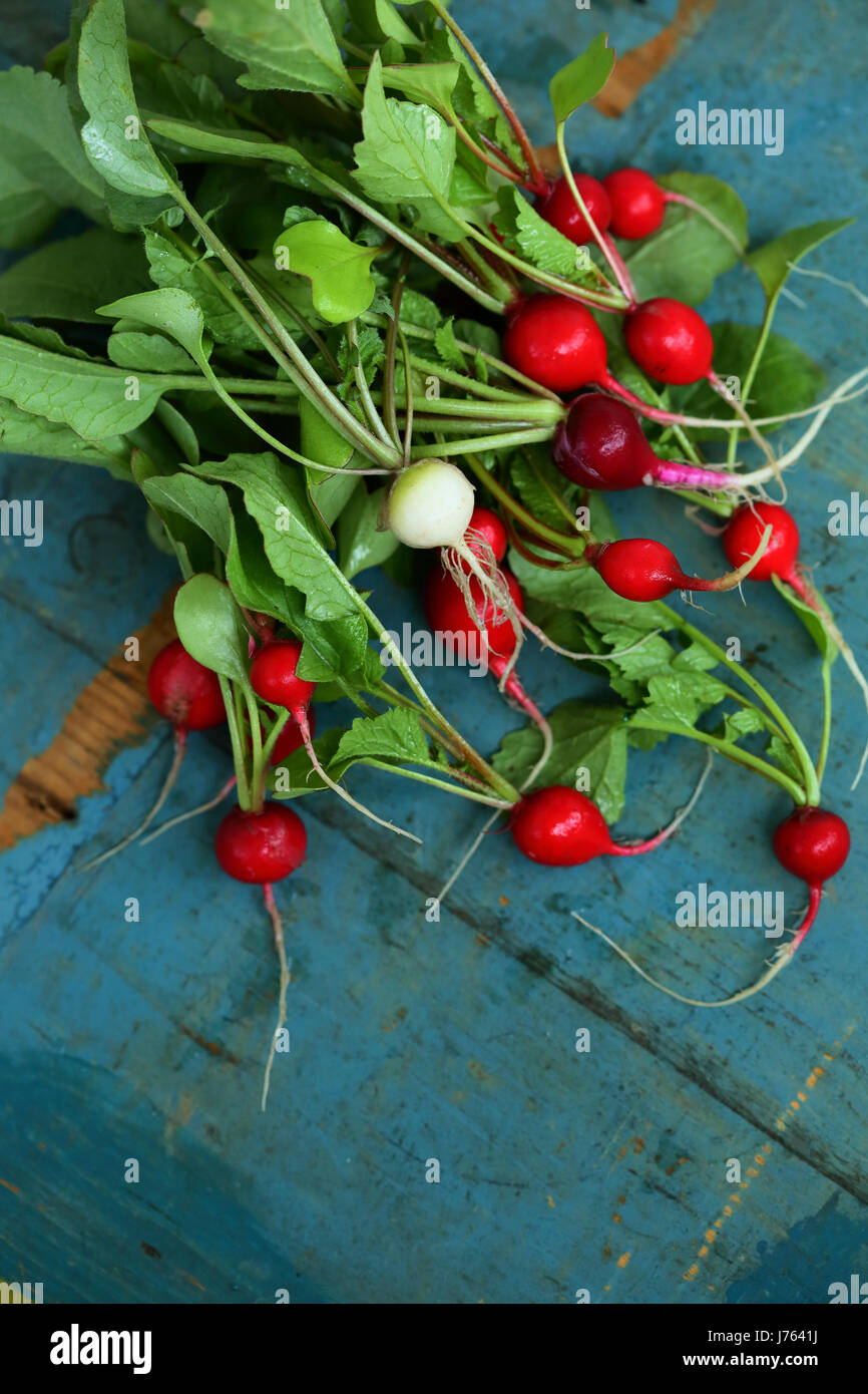 Organic Radish on wood background, food top view Stock Photo - Alamy