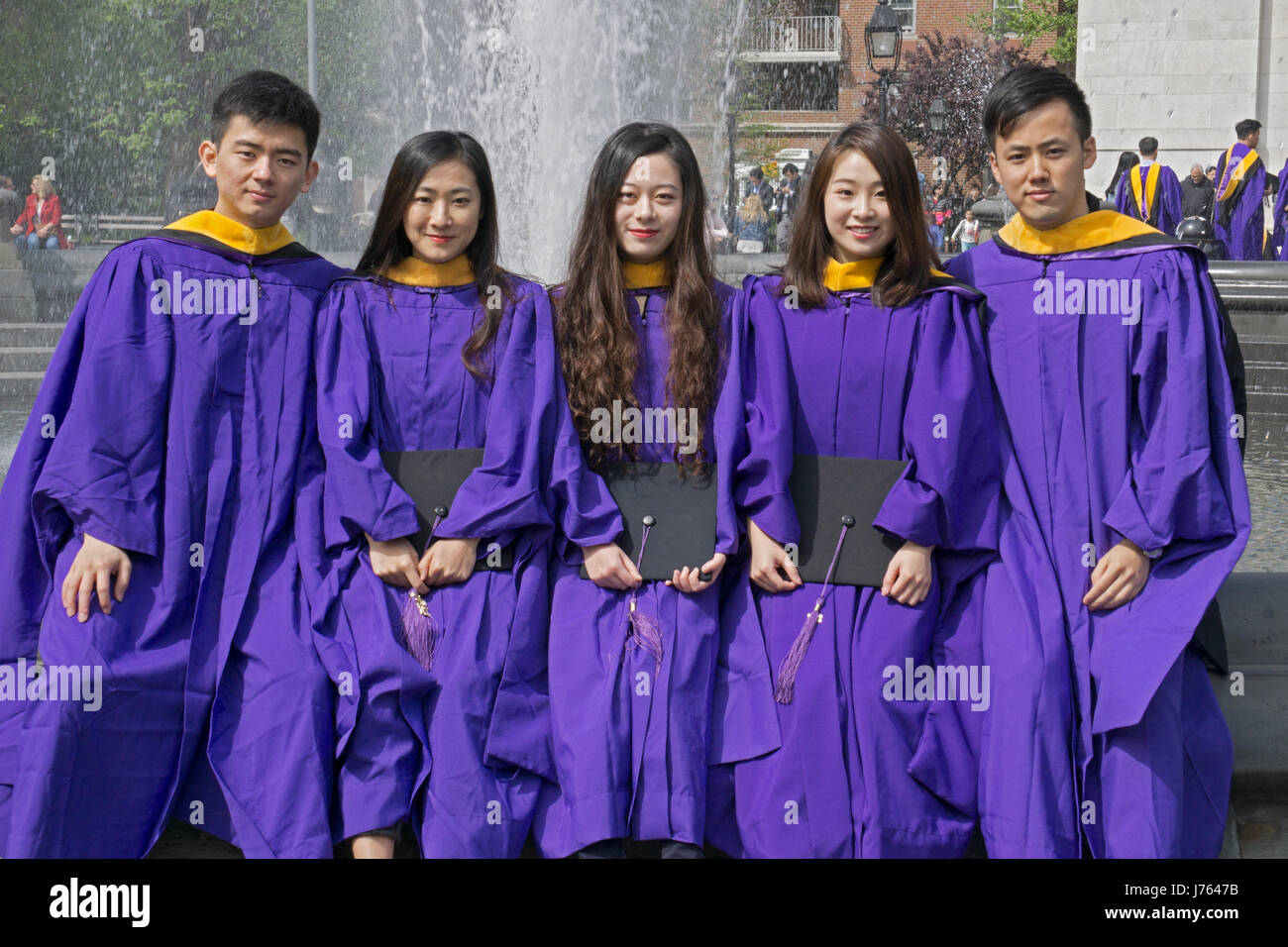 A group of Chinese students at NYU celebrating their graduation in ...