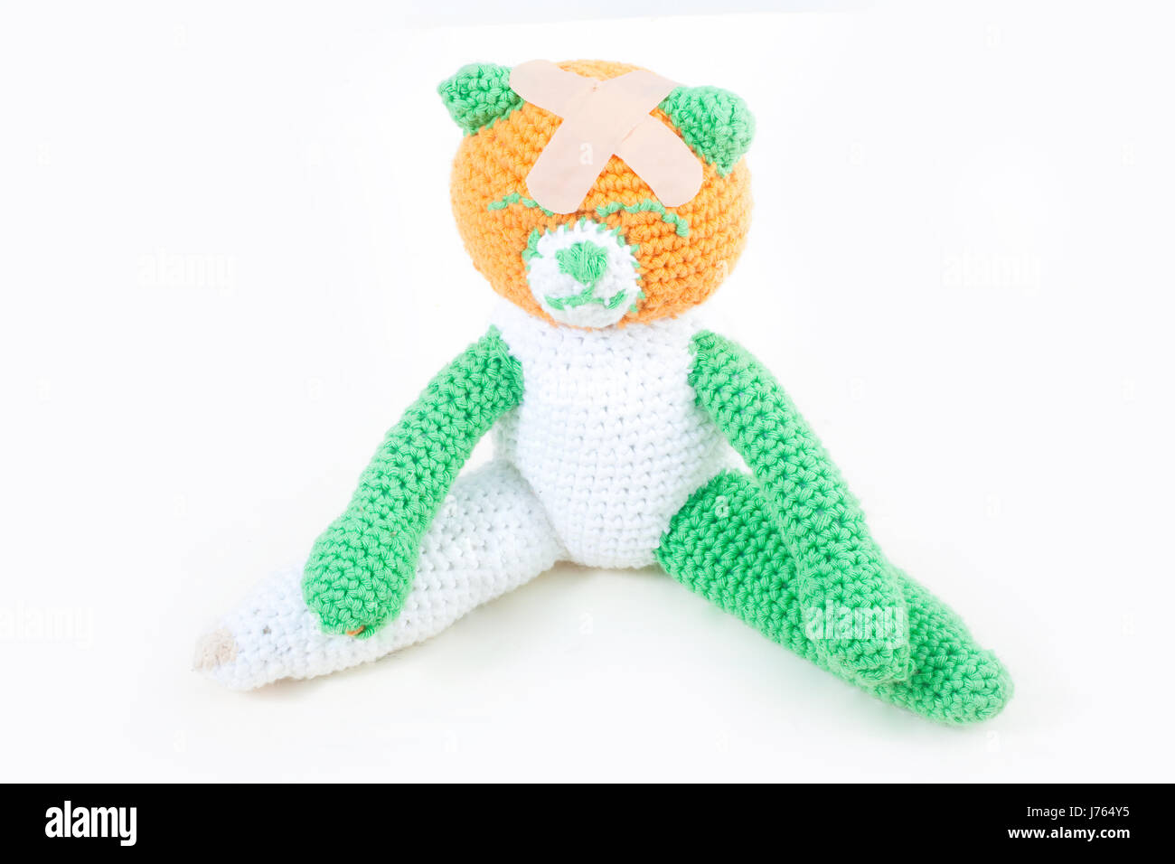 cat soft toy with plaster Stock Photo - Alamy