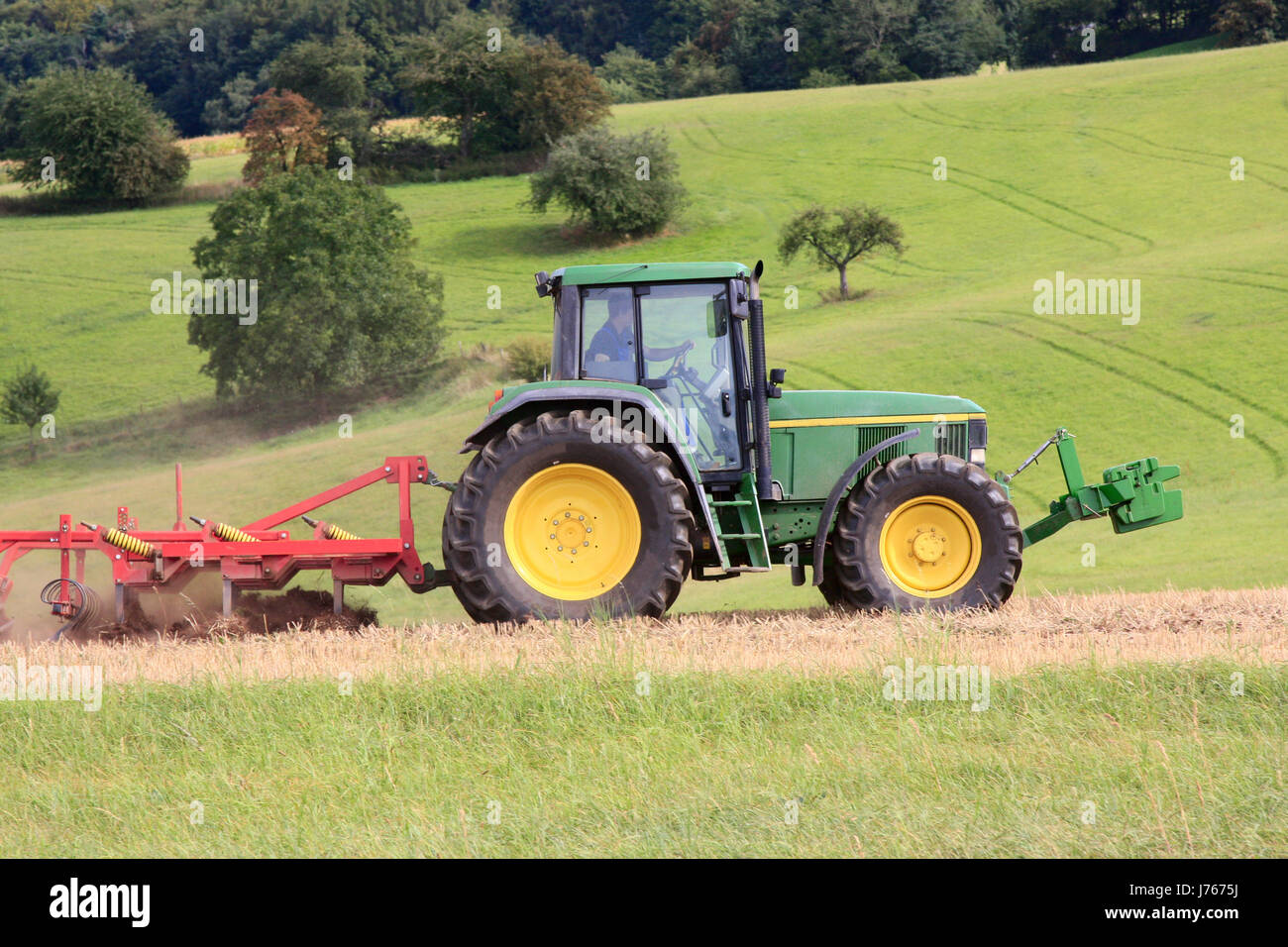 tractor on the field Stock Photo - Alamy