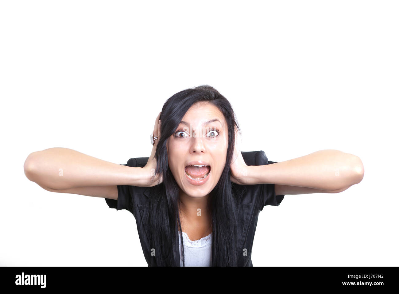 young woman screaming and covering his ears Stock Photo - Alamy