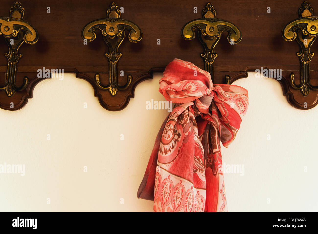 Colored scarf on antique hanger Stock Photo - Alamy