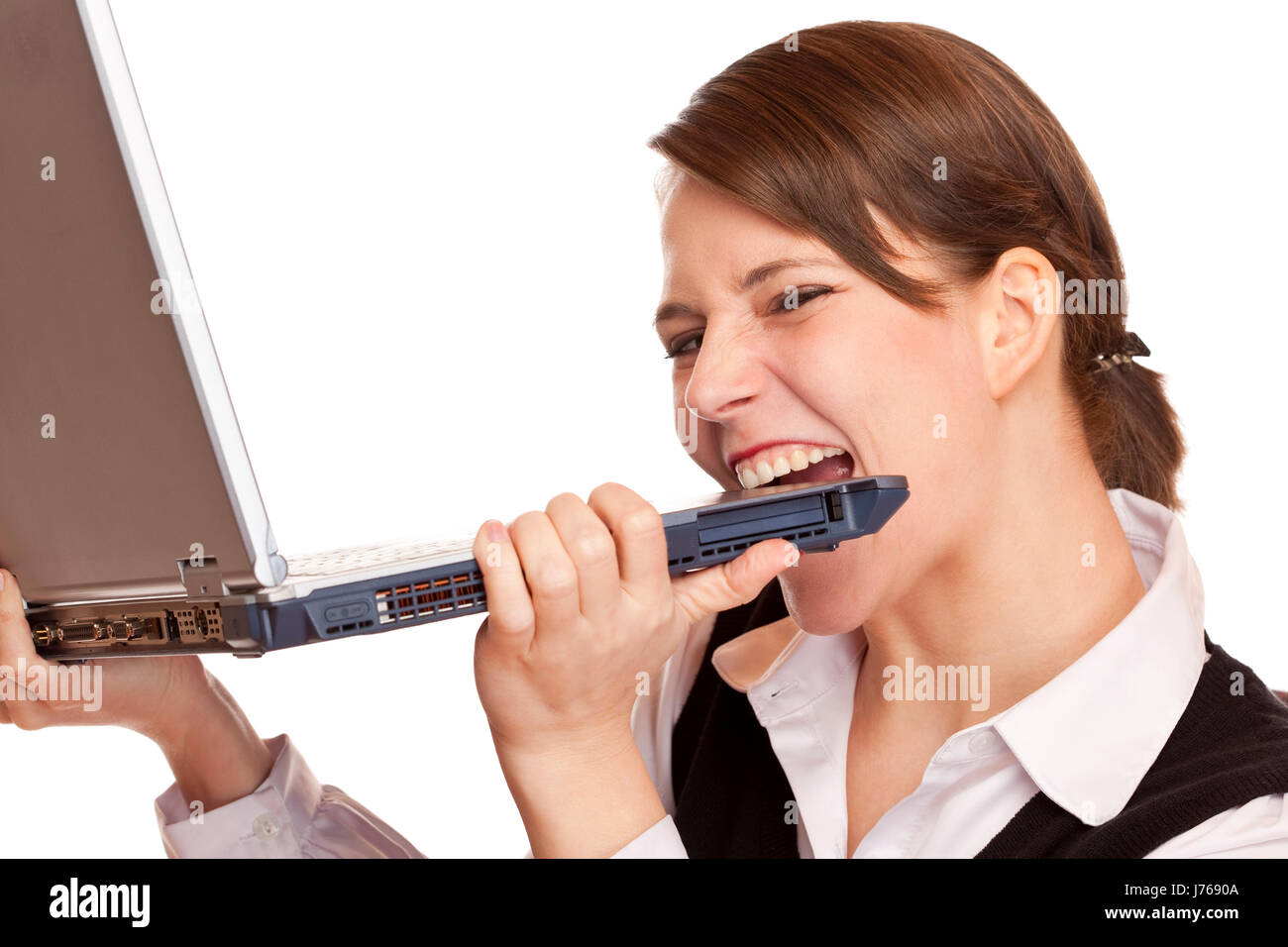 frustrated stressed woman bites in laptop Stock Photo - Alamy