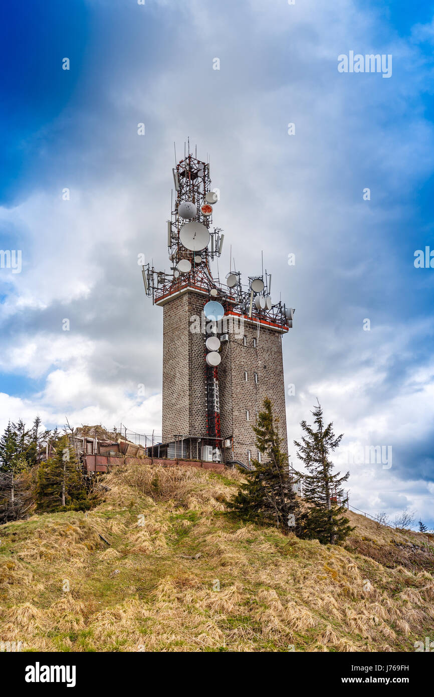 Telecommunication tower with satellite dishes and radio antennas on ...