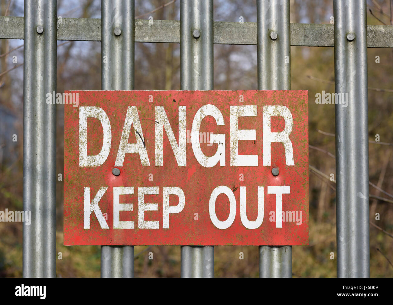 Danger keep out sign, white letters on red background fixed to ...