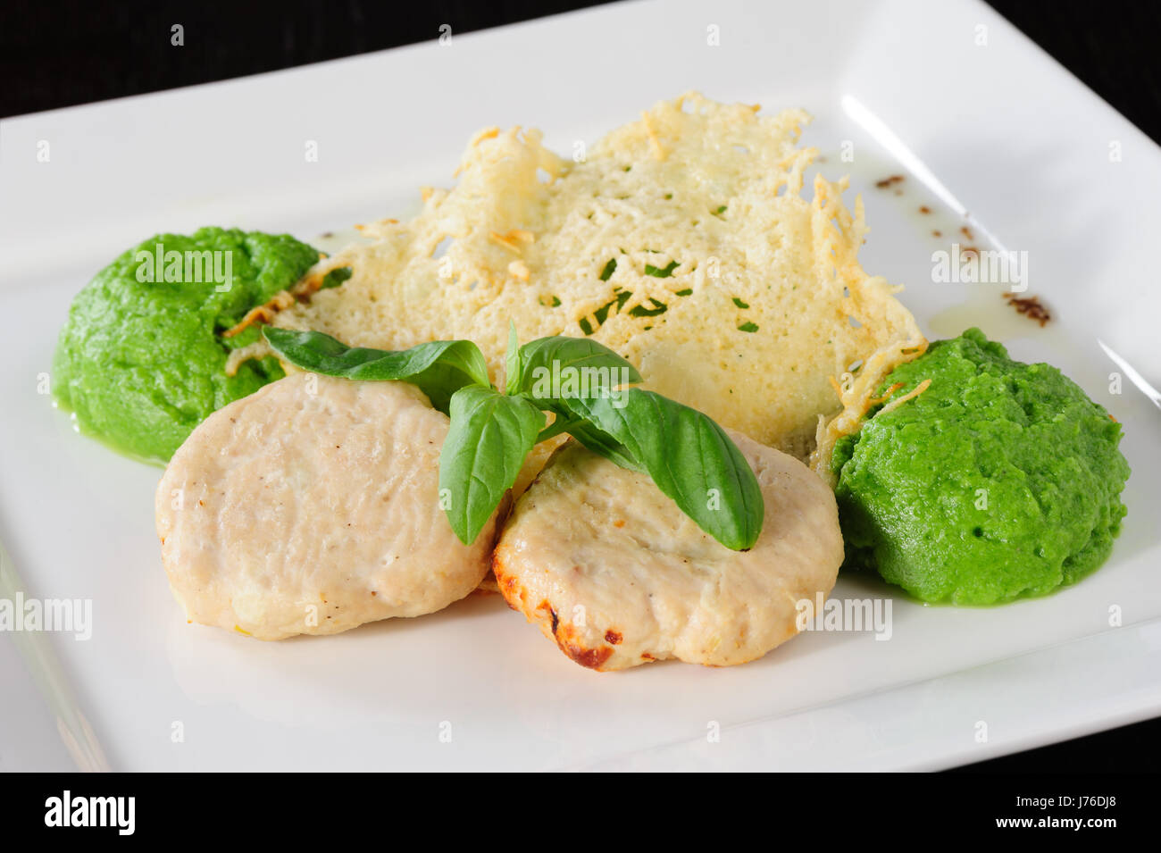 Steamed meatballs with potato-broccoli puree Stock Photo - Alamy