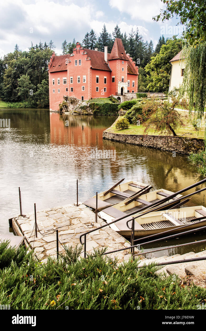 Cervena Lhota chateau with small boats in the lake, Czech republic ...