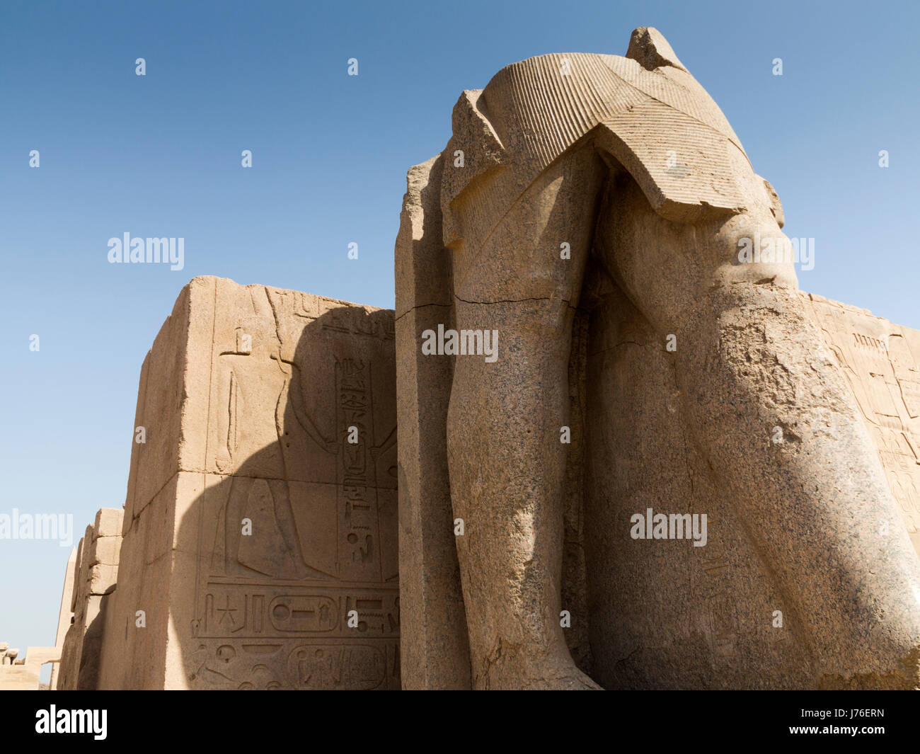Base of colossal statue at Karnak Temple, Luxor Egypt Stock Photo - Alamy