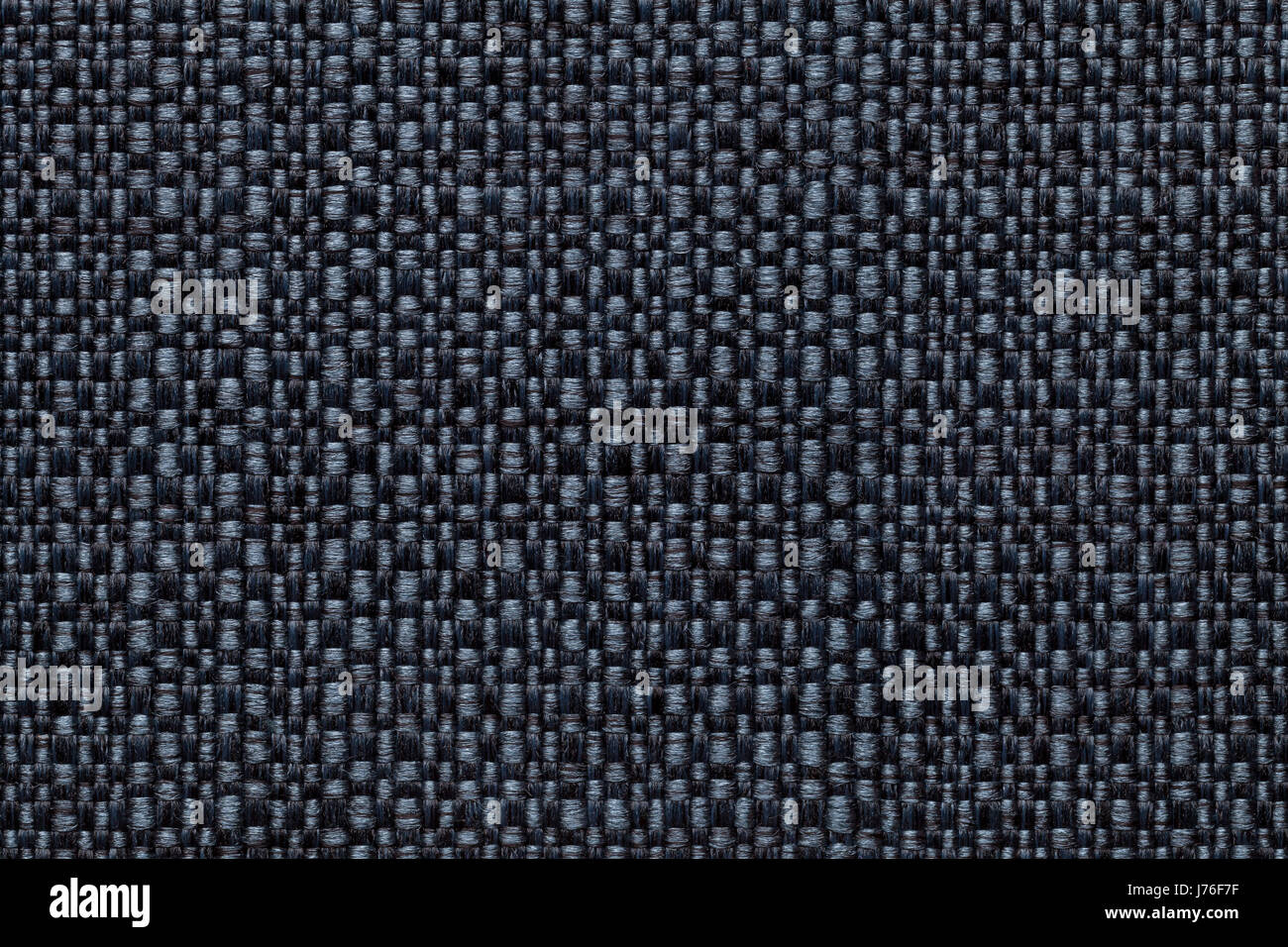 Navy blue background with checkered pattern, closeup. Structure of the ...