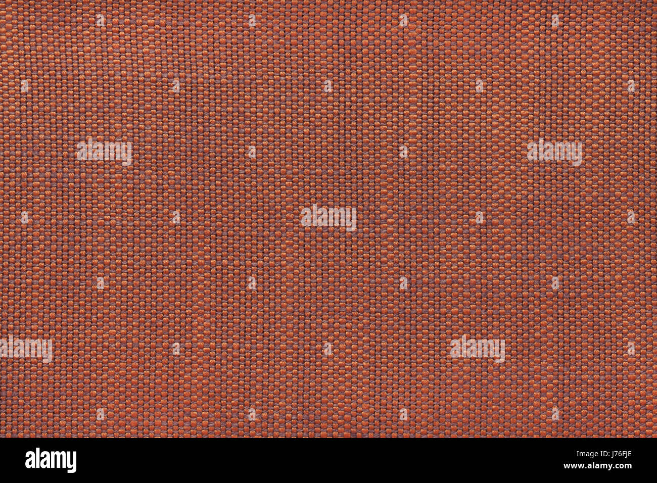 Dark orange background with chess pattern, closeup. Structure of the ...