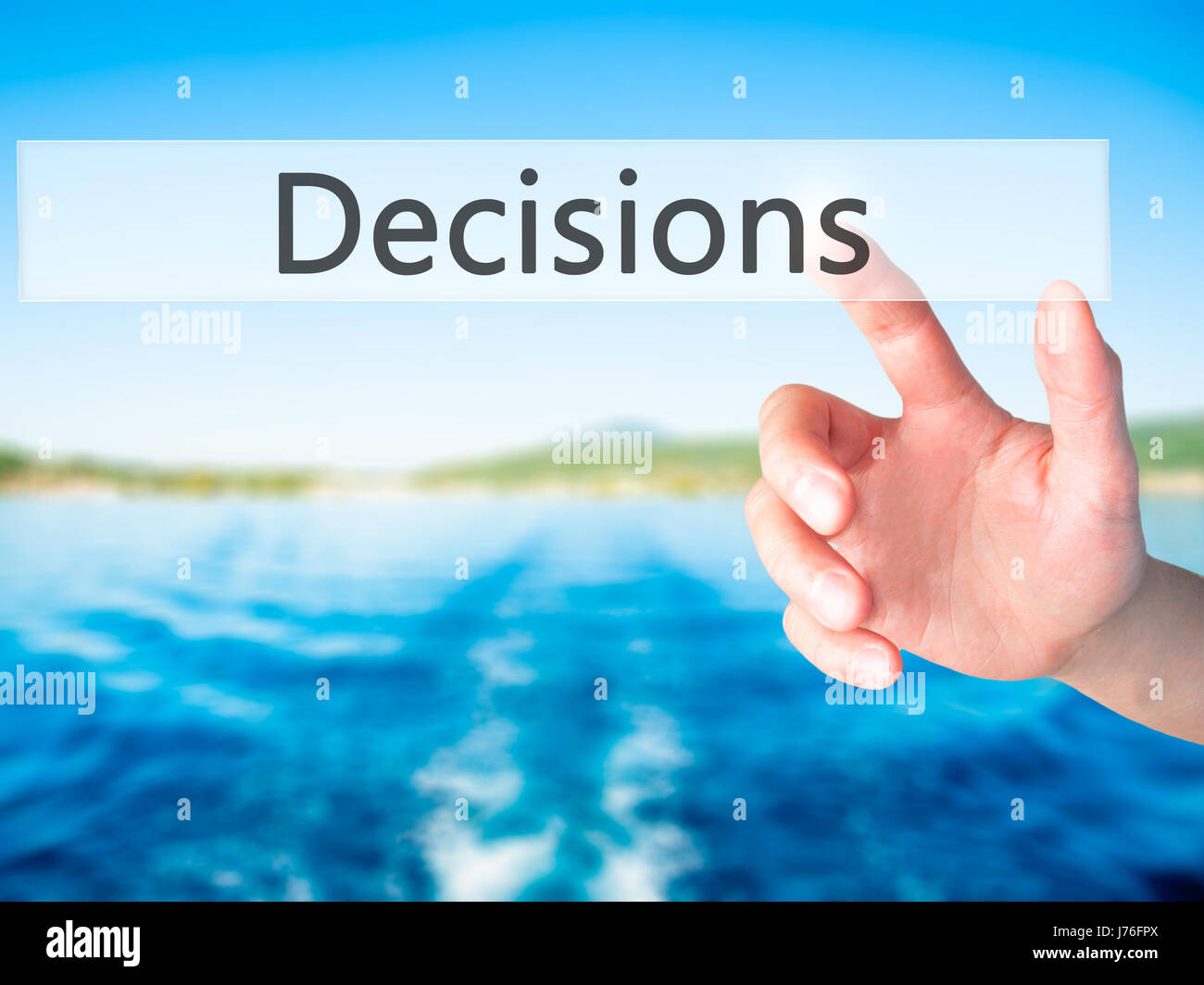 Decisions - Hand pressing a button on blurred background concept ...