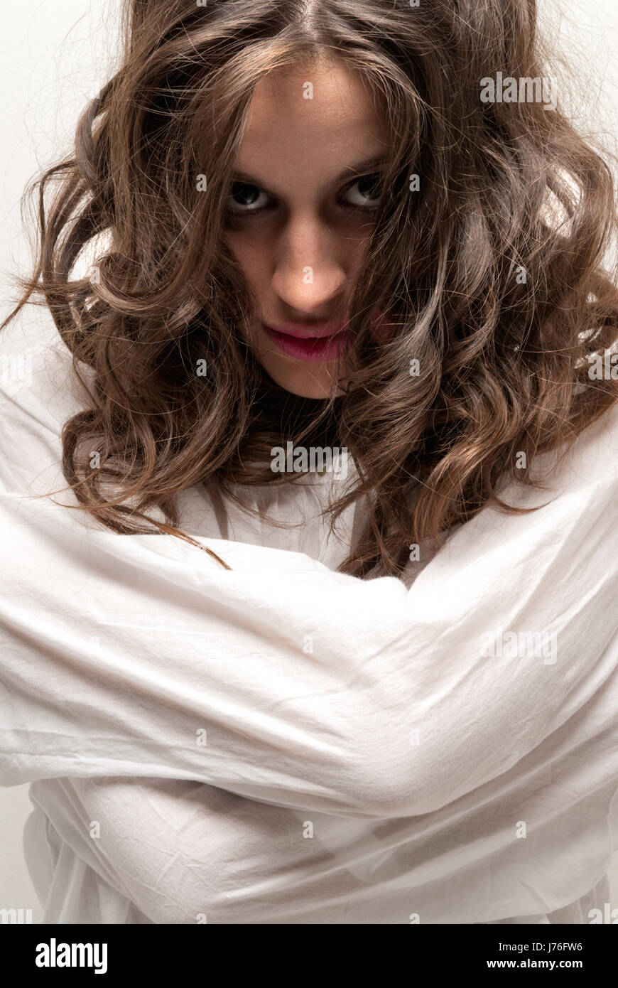 woman expression crazy madness insane straitjacket young younger white ...
