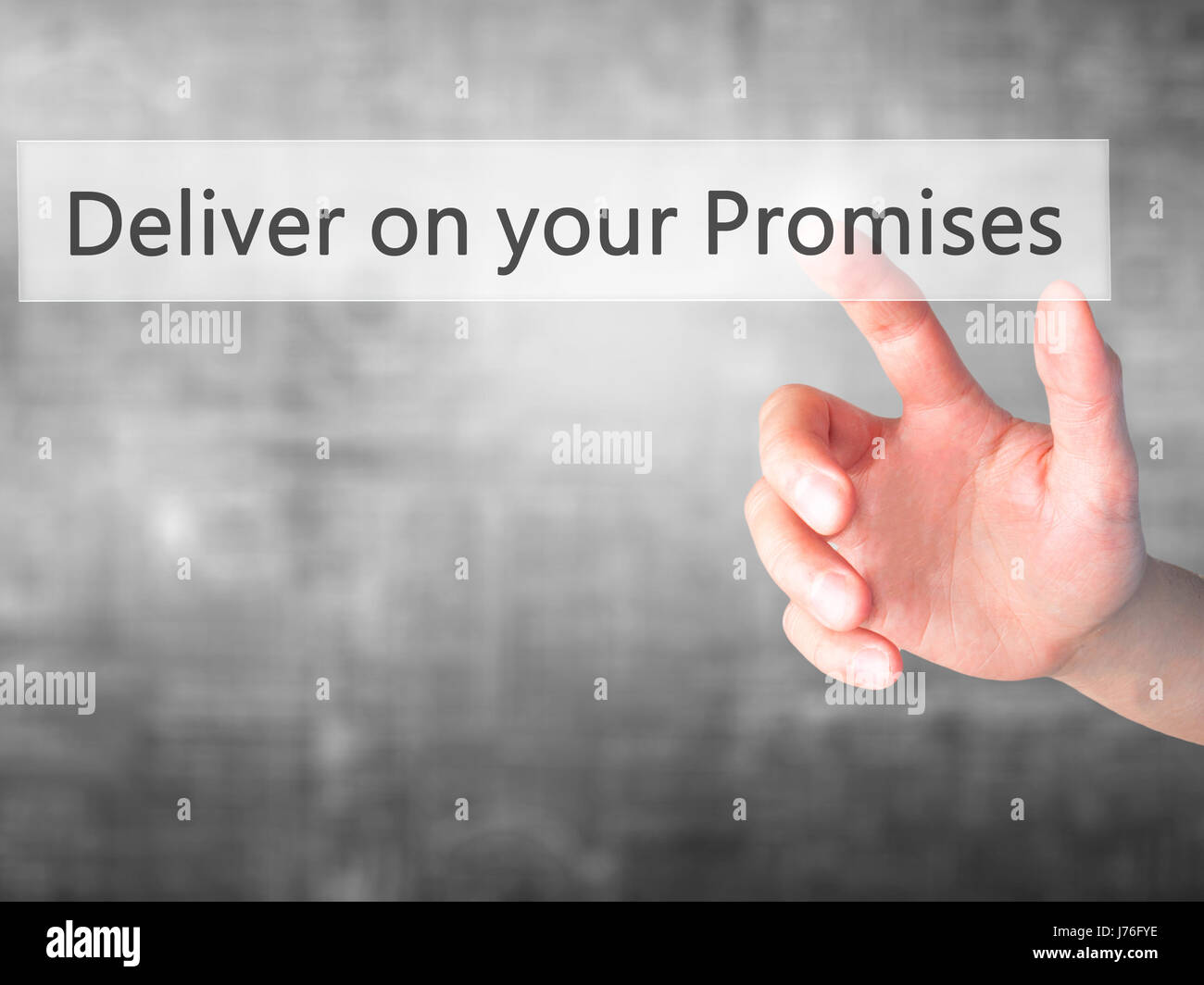 Deliver on your Promises - Hand pressing a button on blurred background ...