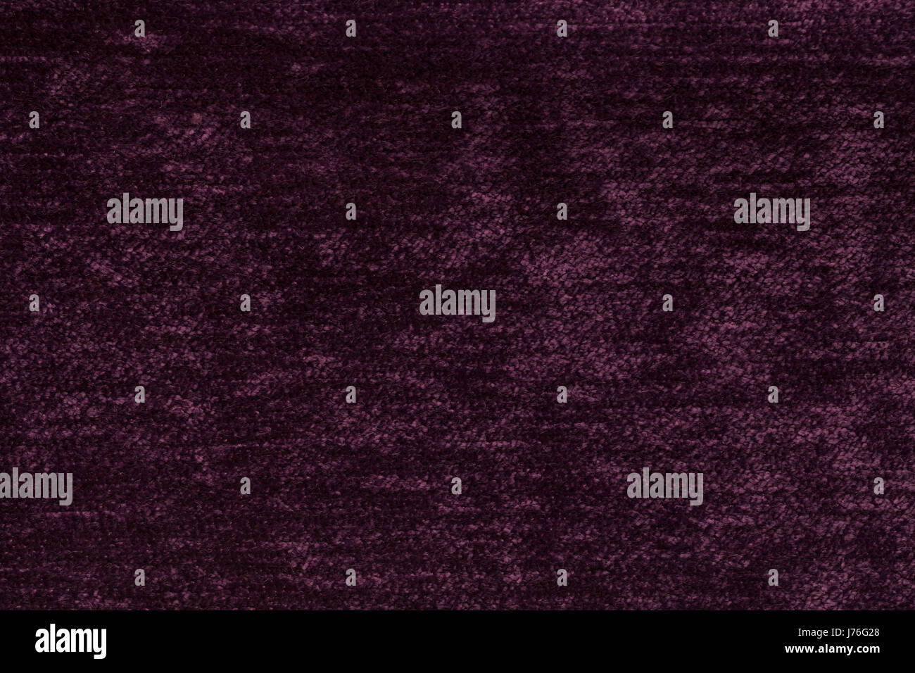 Dark purple background of soft, fleecy cloth. Texture of light maroon ...