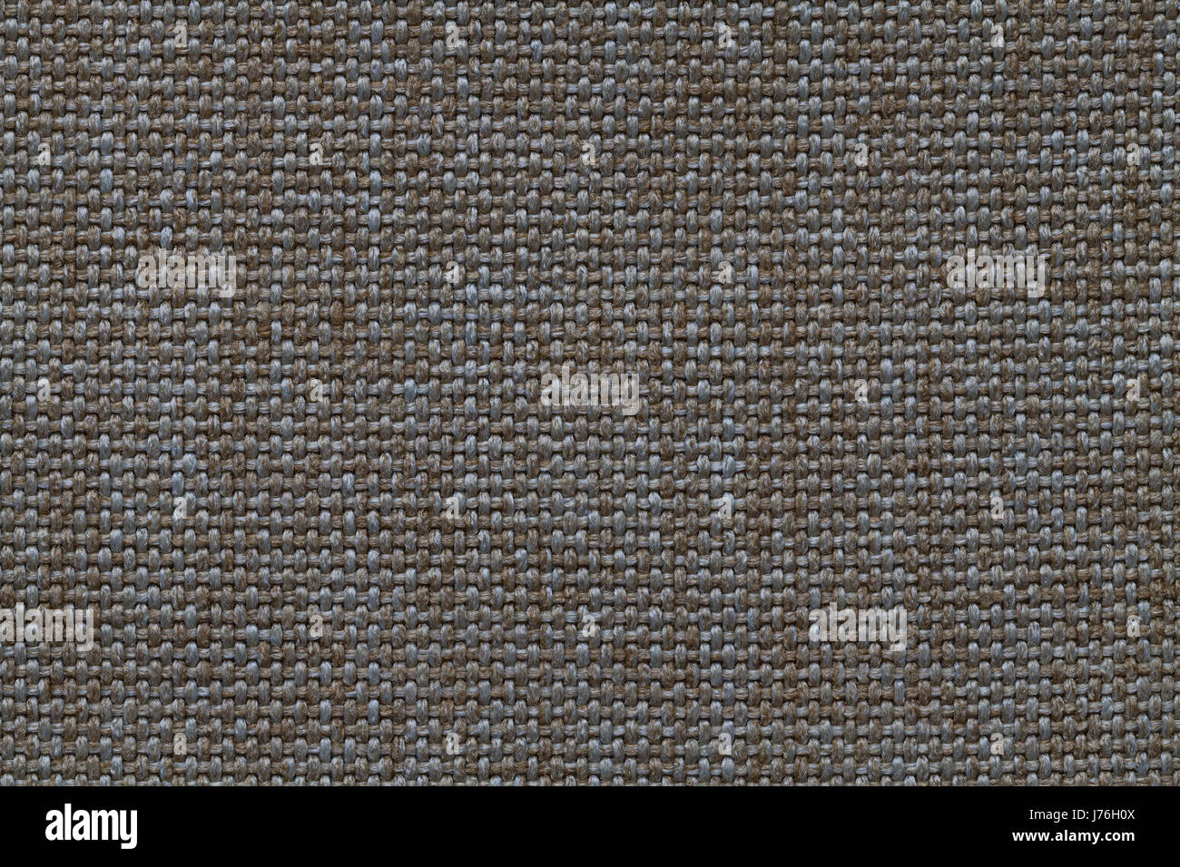 Dark brown and blue woolen background of dense woven bagging fabric ...