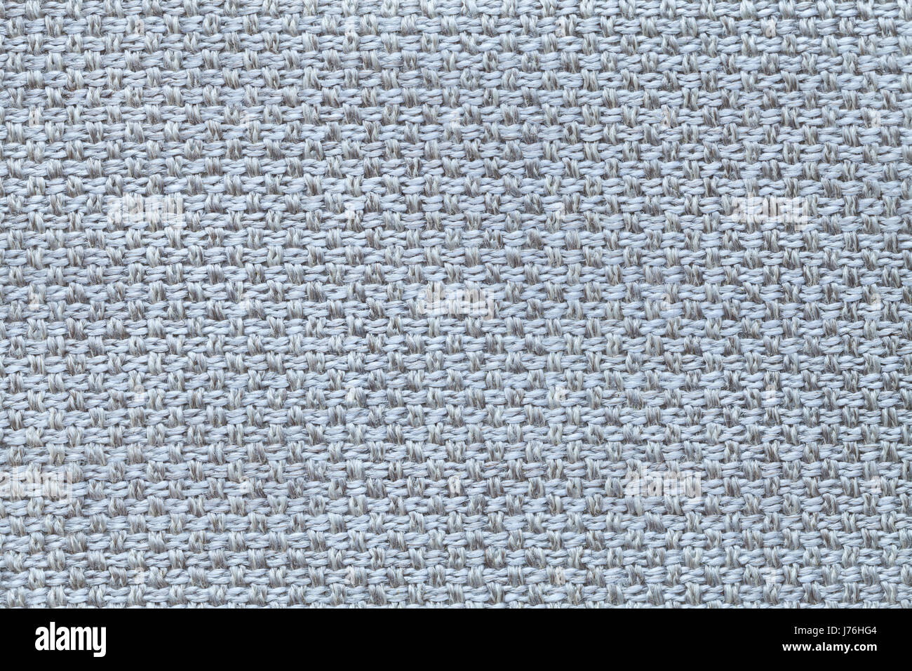 Light blue background with checkered pattern, closeup. Structure of the ...