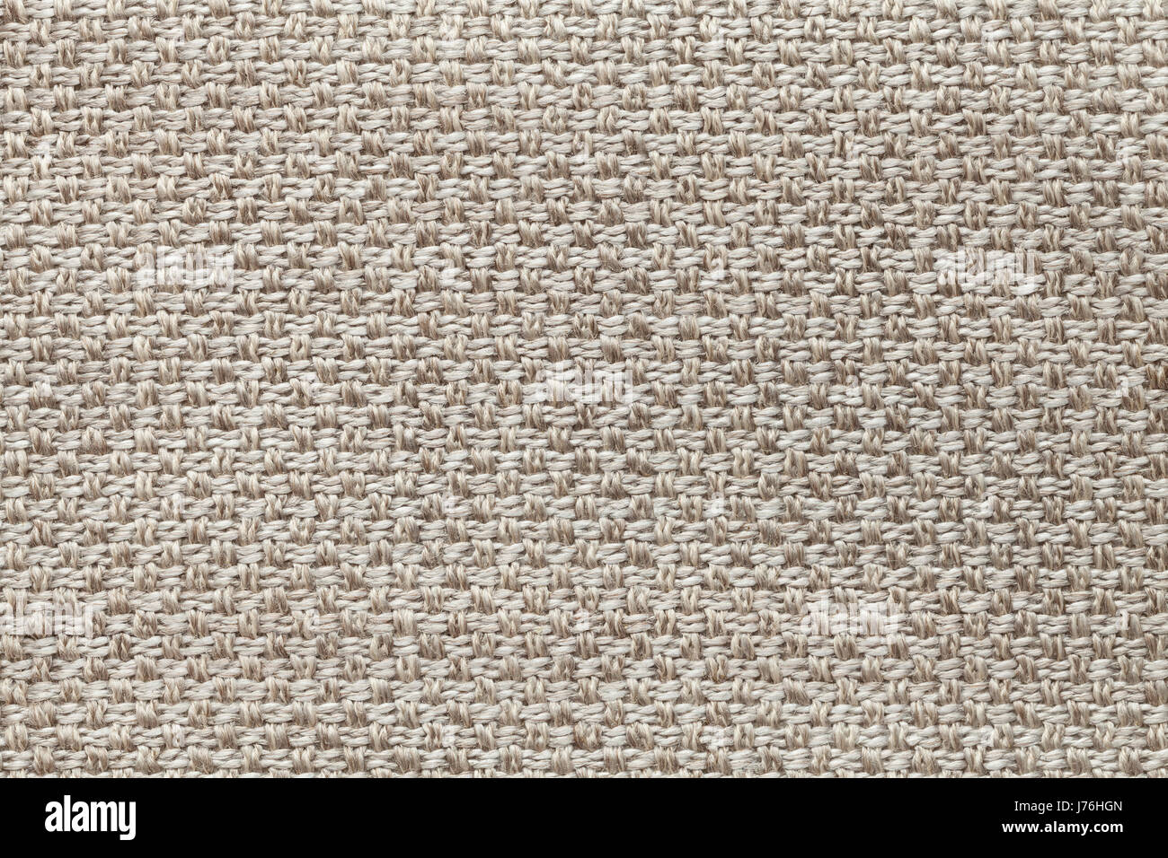 Light brown background with checkered pattern, closeup. Structure of ...