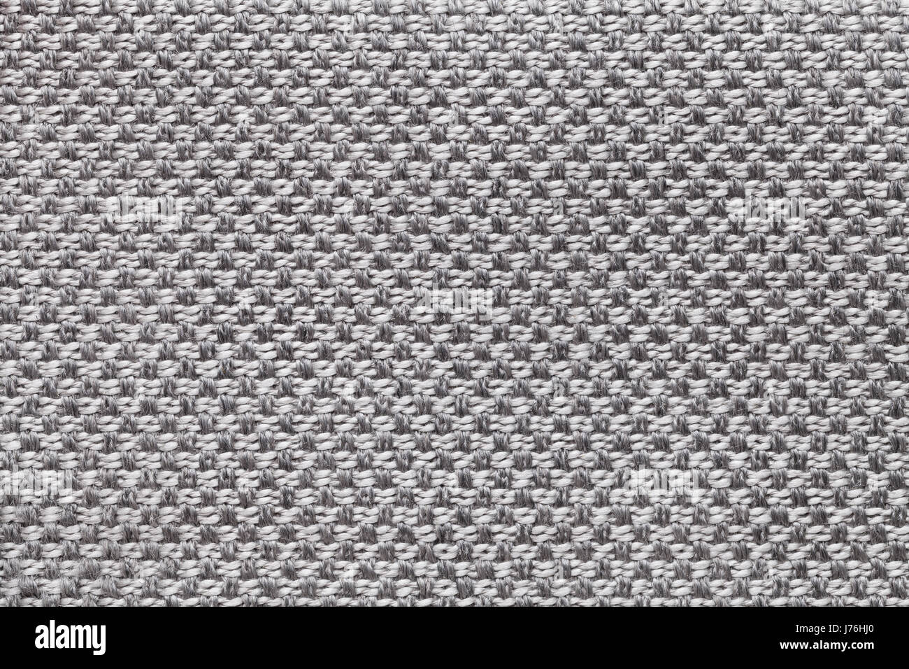 Light gray background with checkered pattern, closeup. Structure of the ...