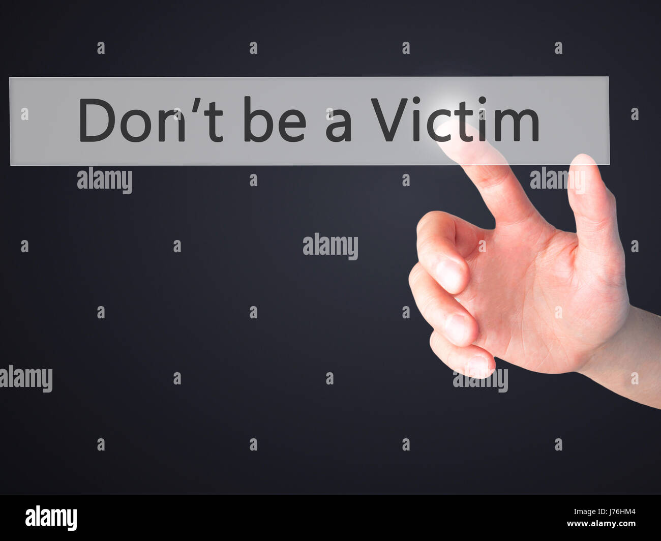 Don't be a Victim - Hand pressing a button on blurred background ...