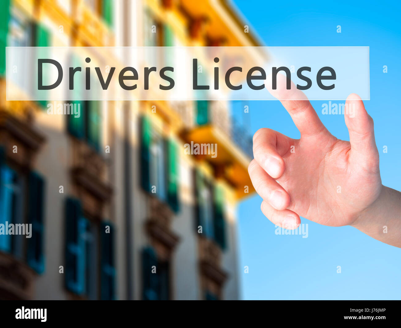 Drivers License - Hand pressing a button on blurred background concept ...