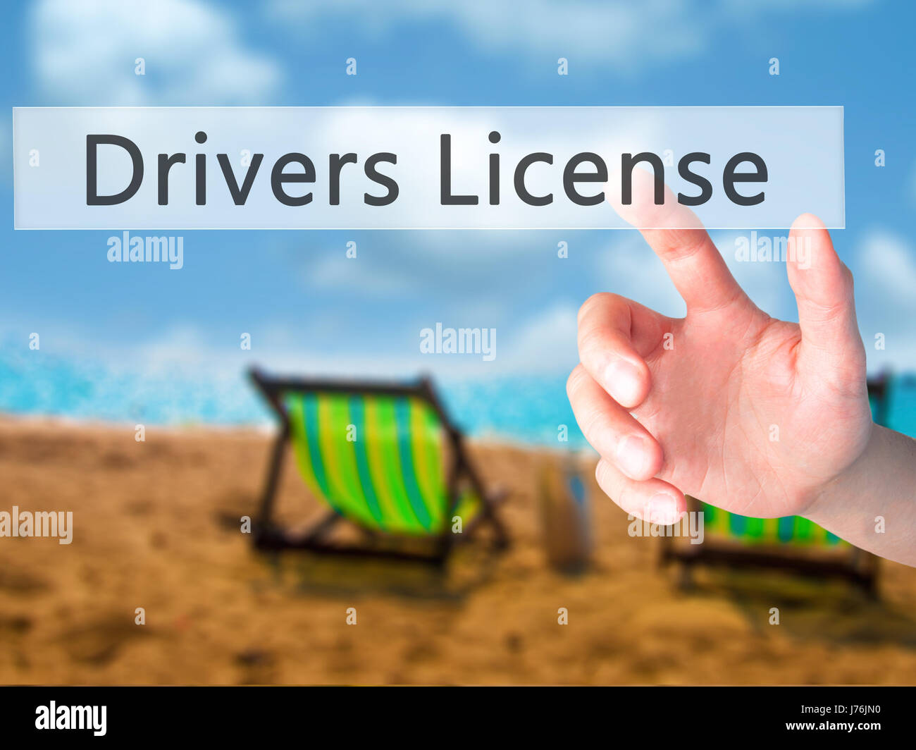 Drivers License - Hand pressing a button on blurred background concept ...