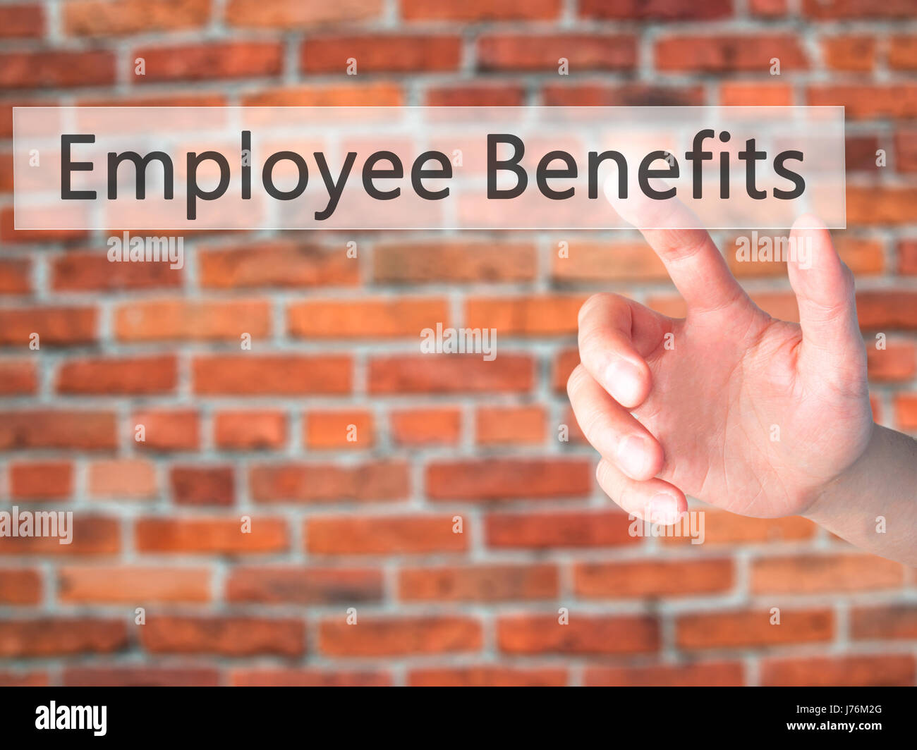 Employee Benefits - Hand pressing a button on blurred background ...