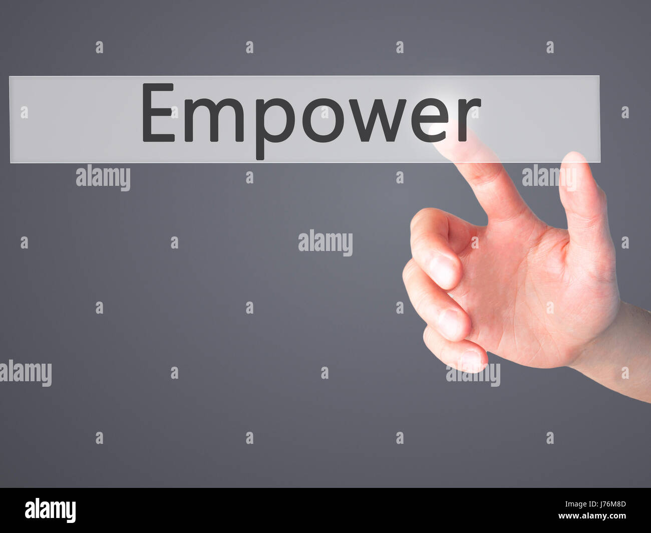 Empower - Hand pressing a button on blurred background concept ...