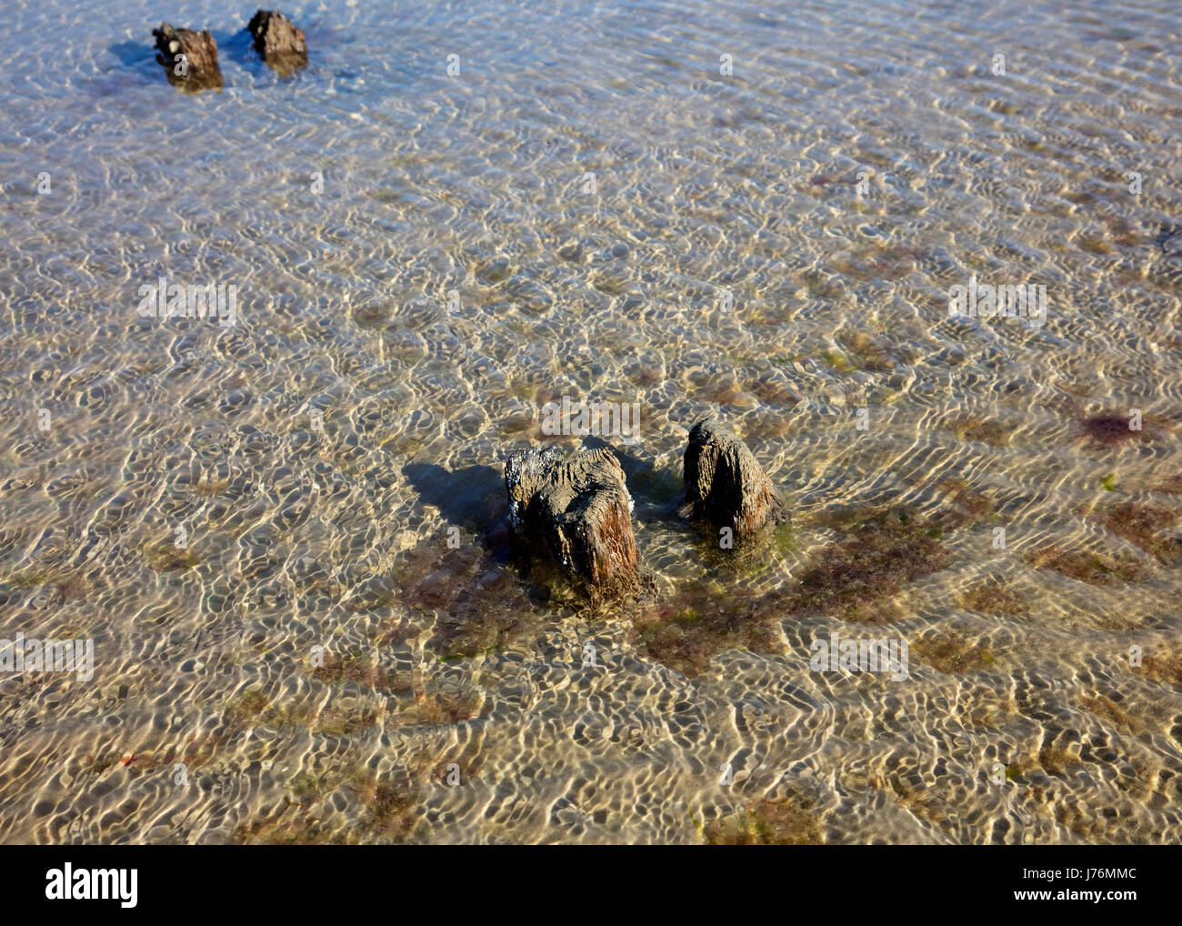 Ripples of shallow sea water on a beach Stock Photo - Alamy