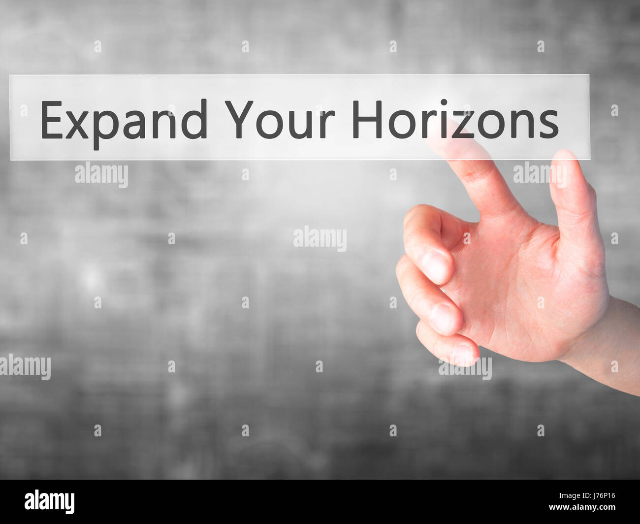 Expand Your Horizons - Hand pressing a button on blurred background ...