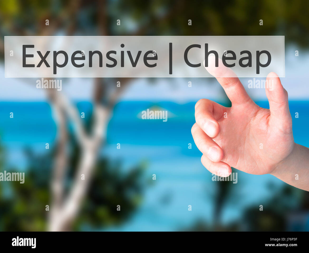 Expensive Cheap - Hand pressing a button on blurred background concept ...