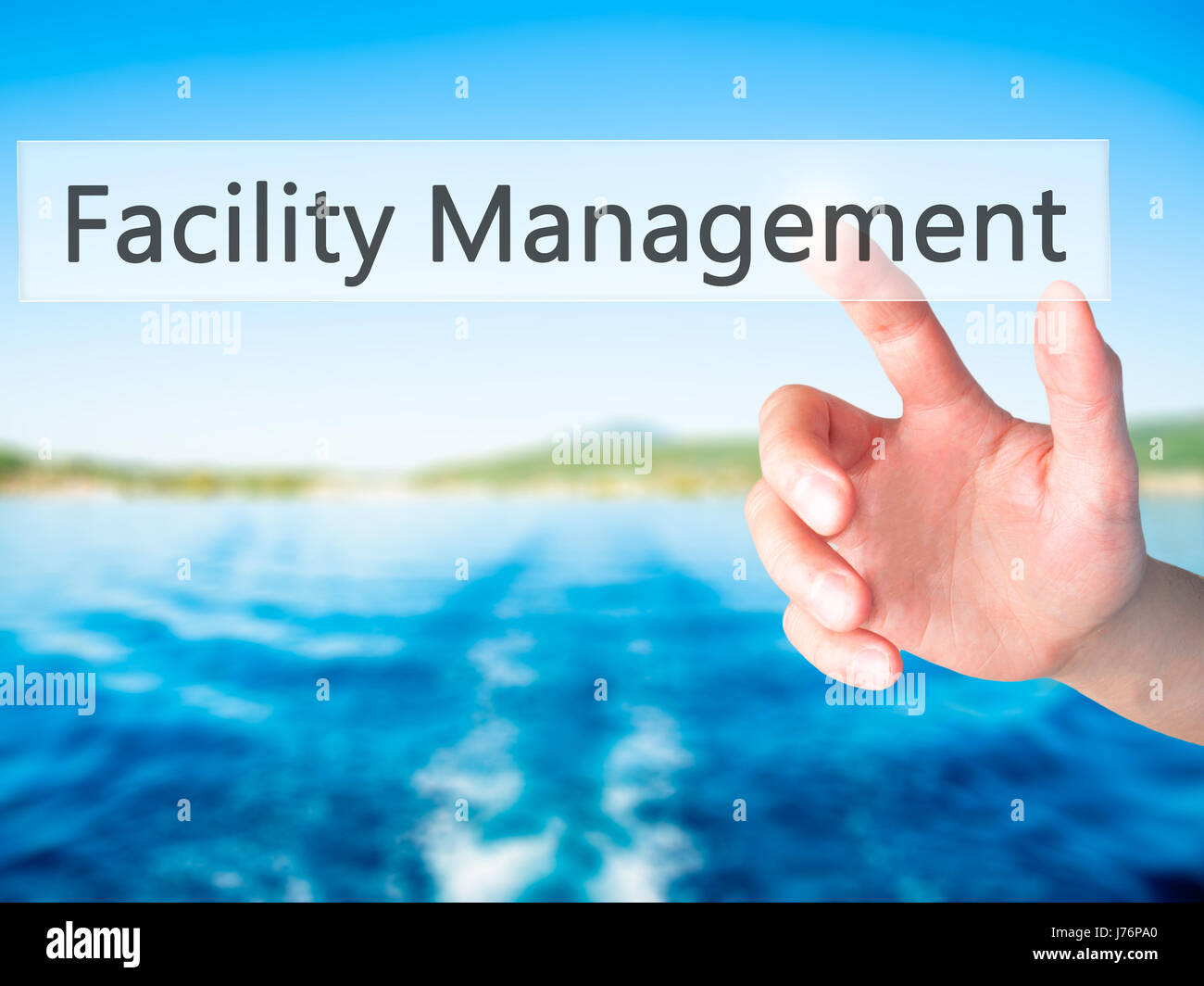 Facility Management - Hand pressing a button on blurred background ...