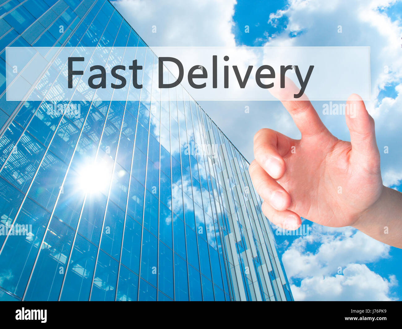 Fast Delivery - Hand pressing a button on blurred background concept ...