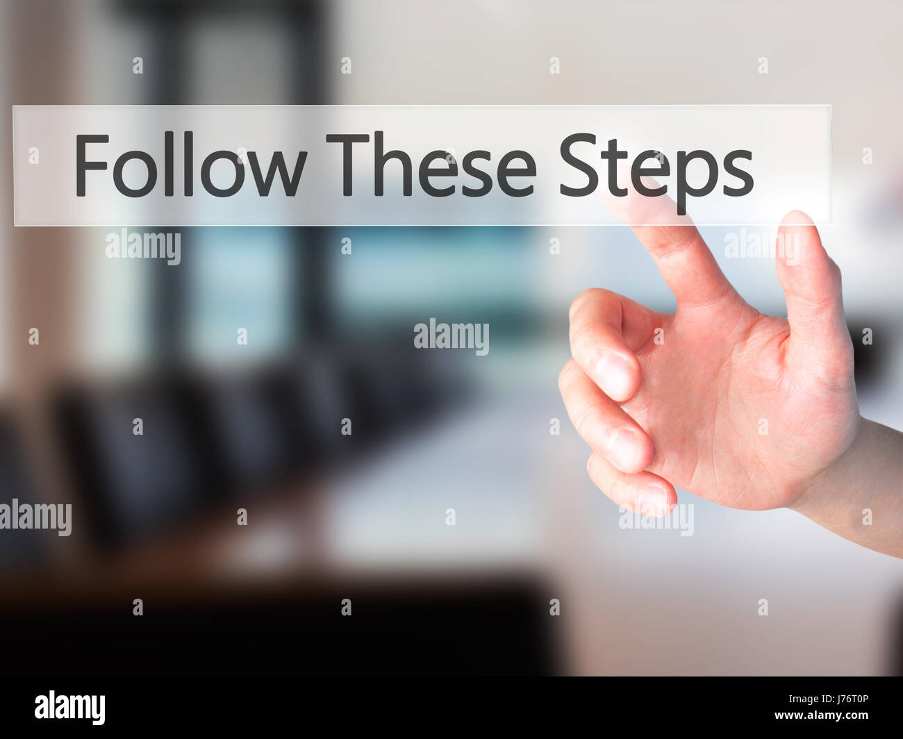 Follow These Steps - Hand pressing a button on blurred background ...