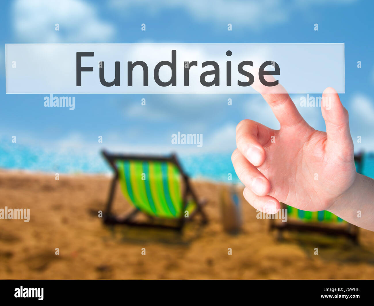 Fundraise - Hand pressing a button on blurred background concept ...