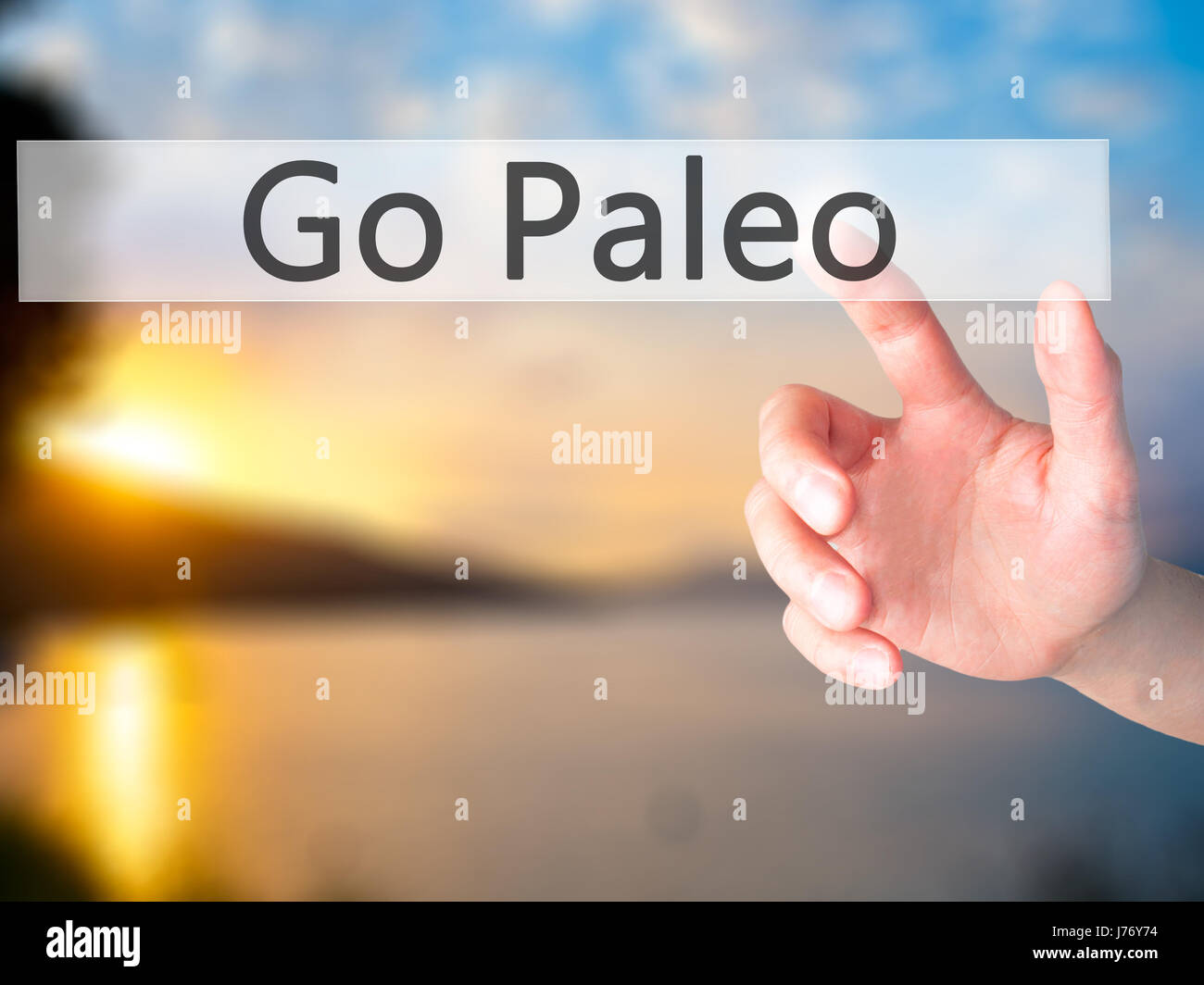 Go Paleo - Hand pressing a button on blurred background concept ...