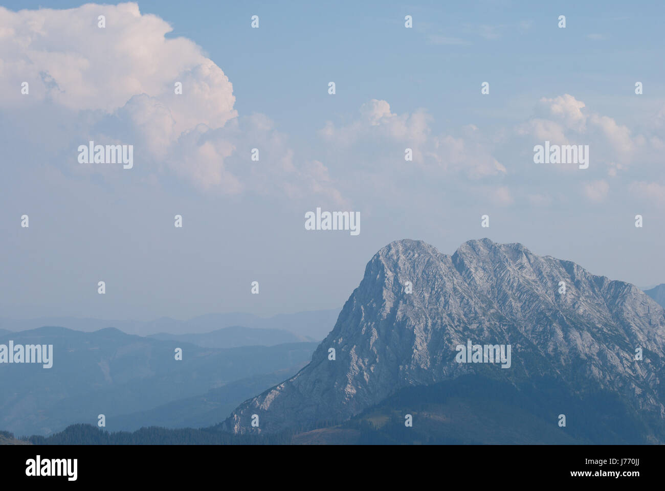 Lugauer peak of the Styrian limestone alps, with clouds of vertical ...